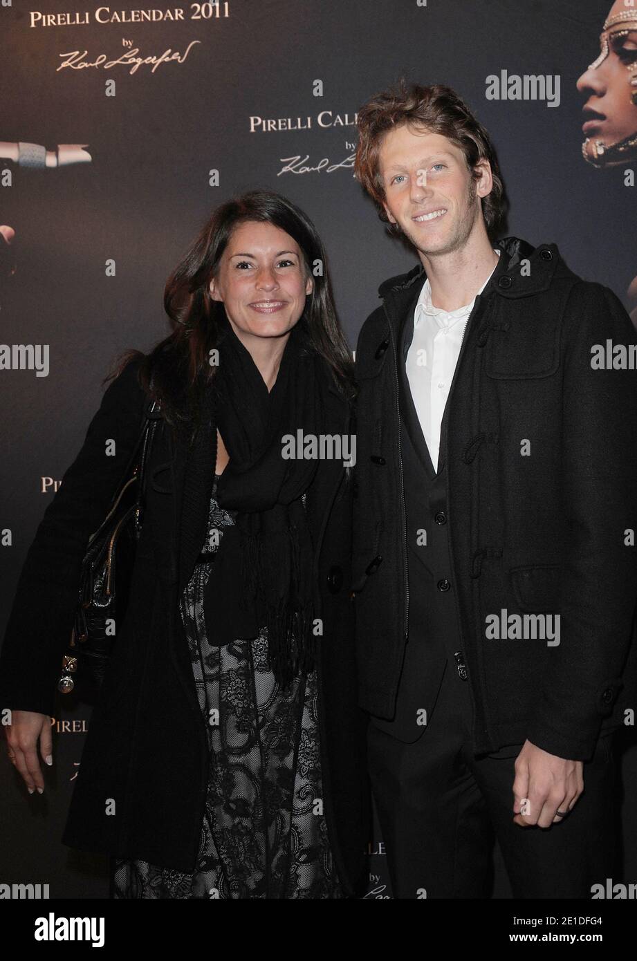 Tv Presenter Marion Jolles and Romain Grosjean attend the Pirelli 2011 Calendar launch at Le ...