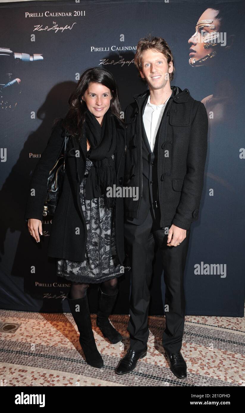 Tv Presenter Marion Jolles and Romain Grosjean attend the Pirelli 2011 Calendar launch at Le ...