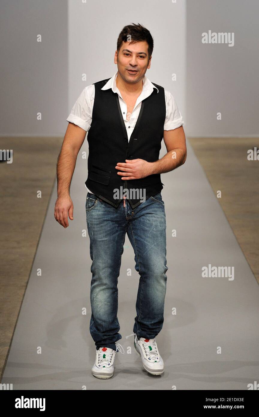 Lebanese designer Khaled el Masri appears on the catwalk at the end of ...