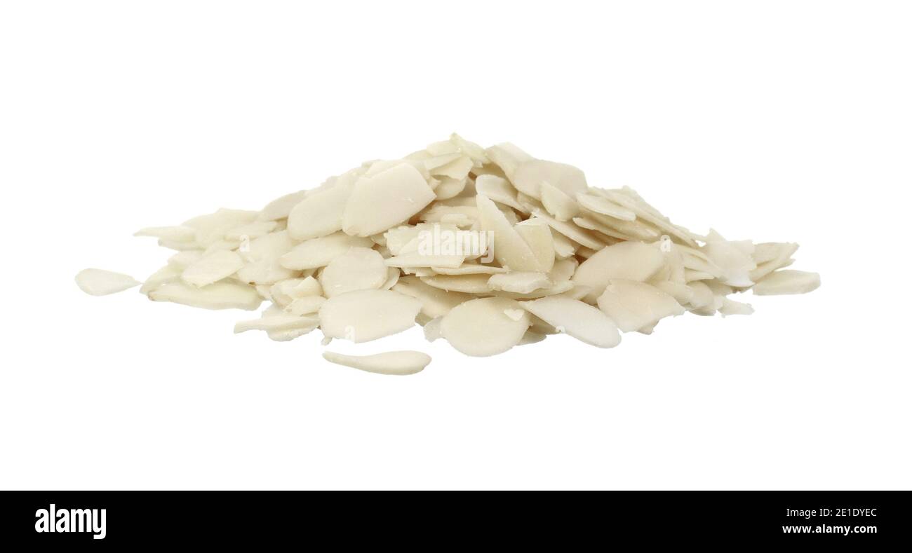 Pile of peeled flaked almonds isolated on white. Blanched almonds ...