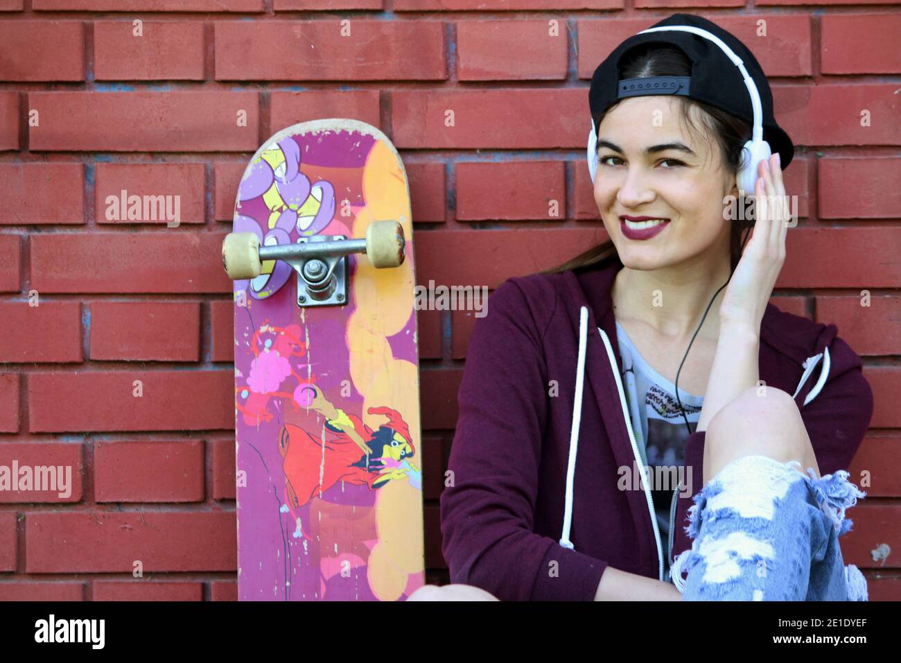 young skater listening music Stock Photo - Alamy