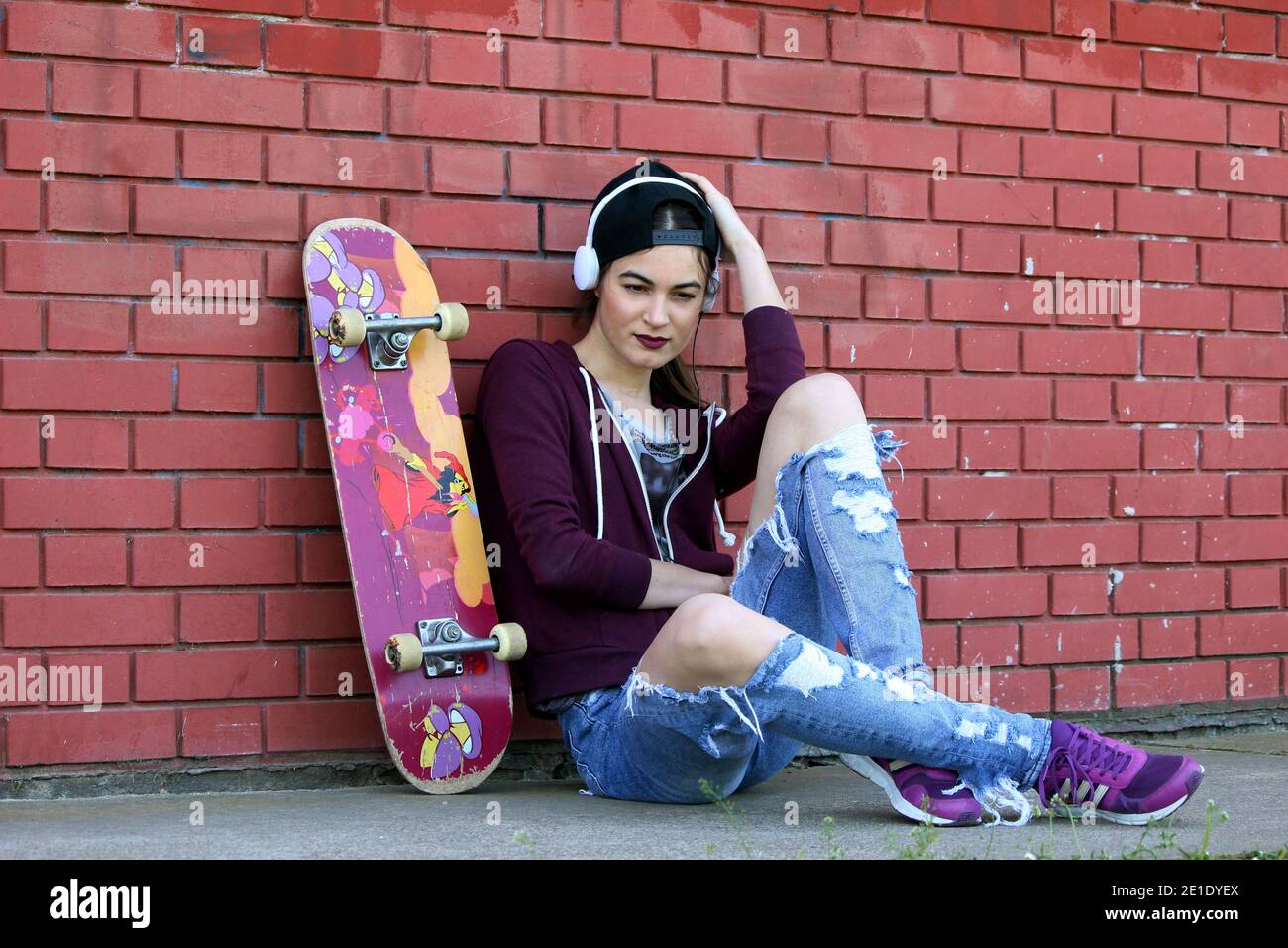 young skater listening music Stock Photo - Alamy