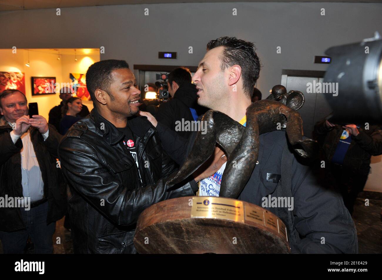 France's Jerome Fernandez celebrates his gold medal and Trophy with ...