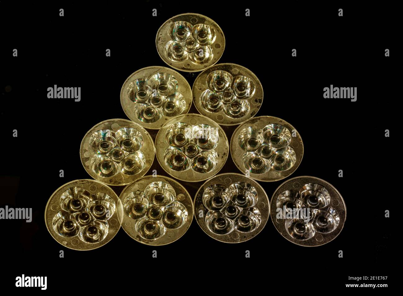 Reflectors in gold stacked as a triangle Stock Photo - Alamy