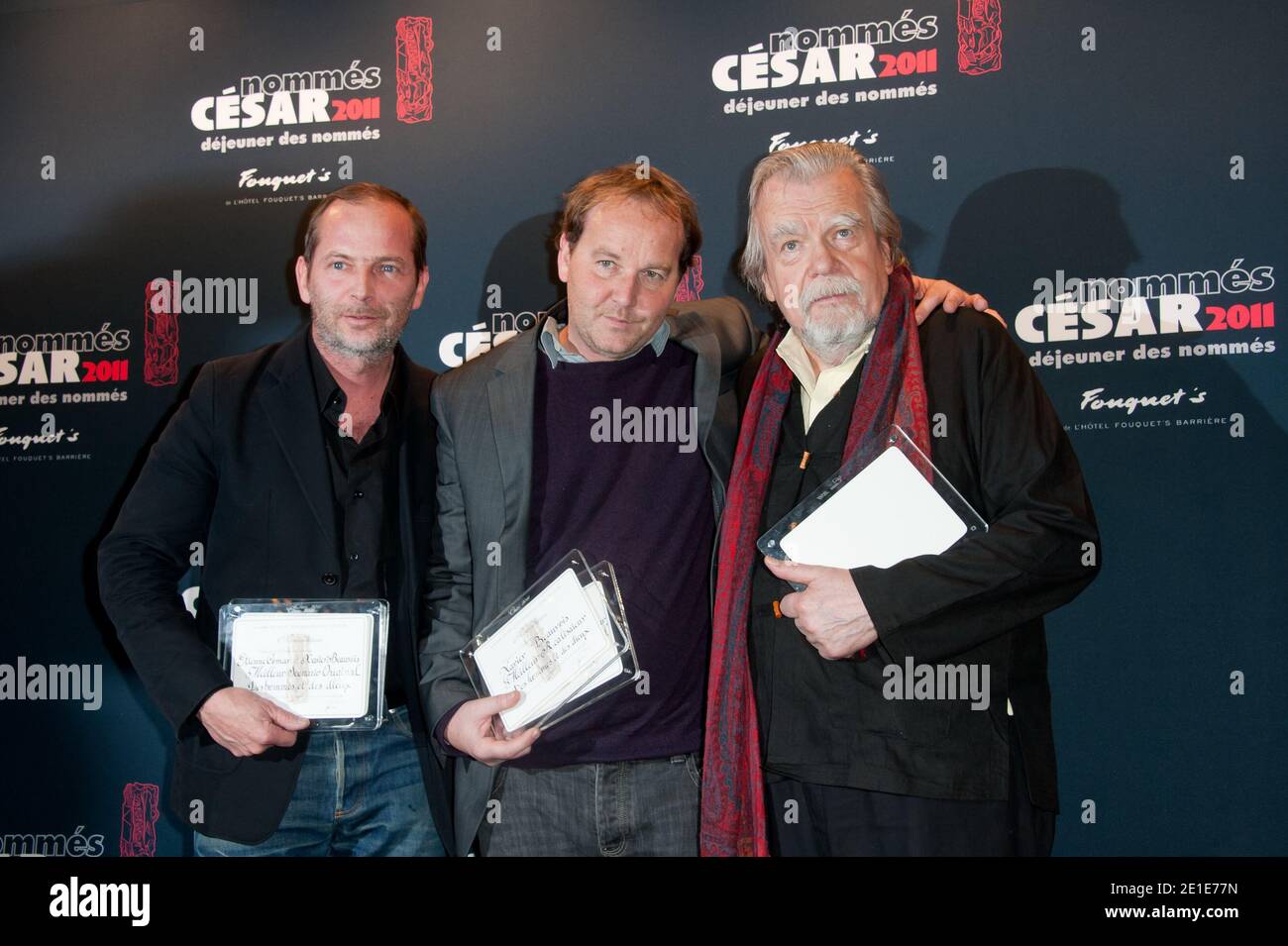 (L-R) Etienne Comar, Xavier Beauvois and Michael Lonsdale celebrate ...