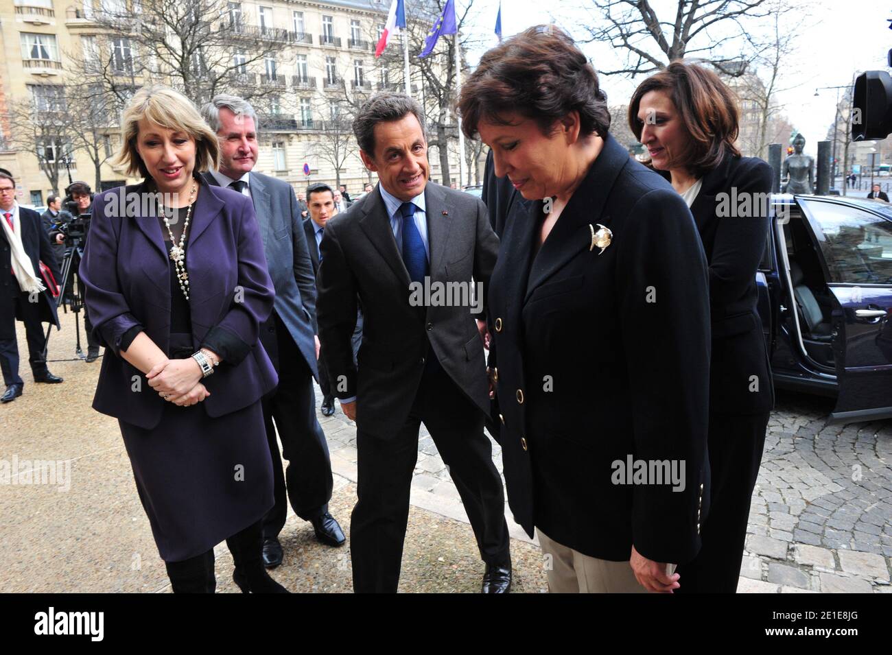 French President Nicolas Sarkozy arrives flanked by Marie-Anne ...