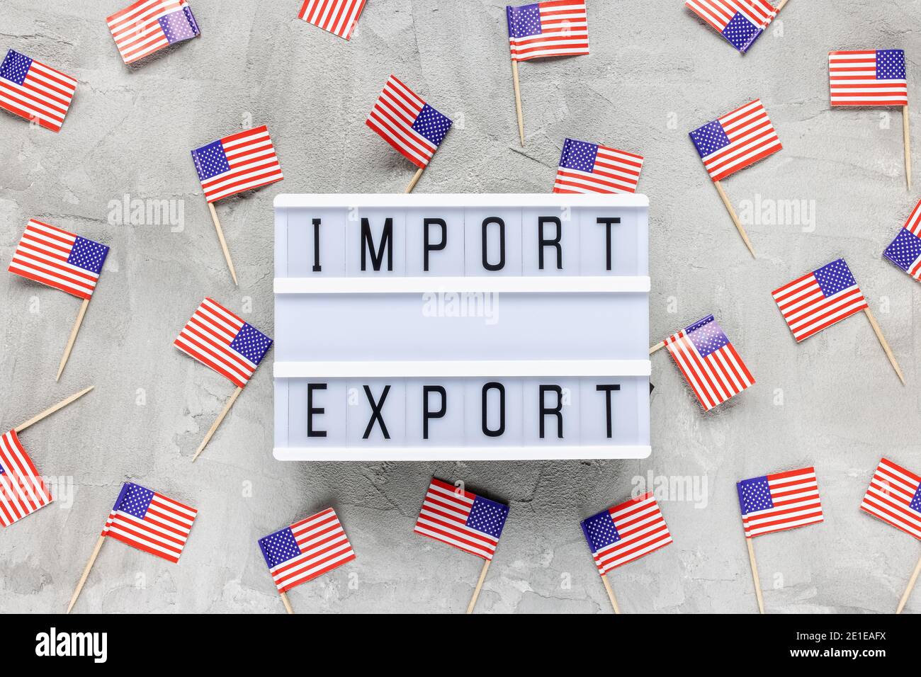 USA flags and text IMPORT EXPORT on gray Stock Photo - Alamy