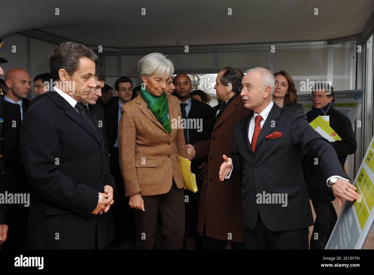 French President Nicolas Sarkozy flanked by Axon’Cable’s CEO Joseph ...