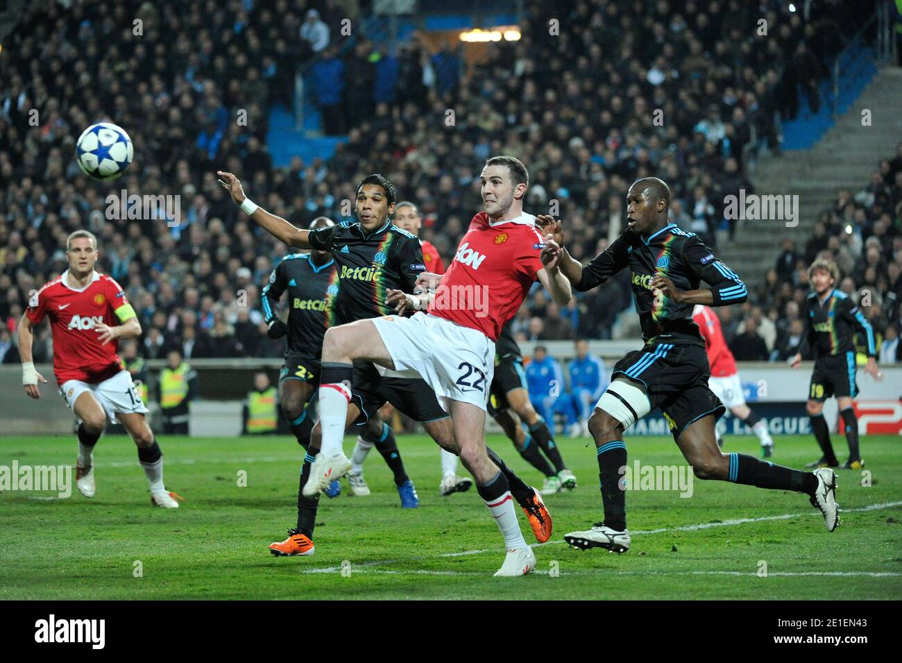 Brandao and Rod Fanni of Marseille with John O'Shea of Man Utd during ...