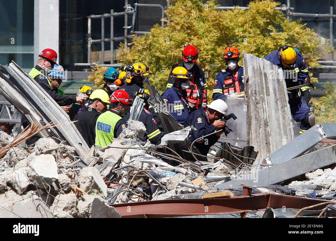 Emergency services work to remove a body from the site of the CTV ...