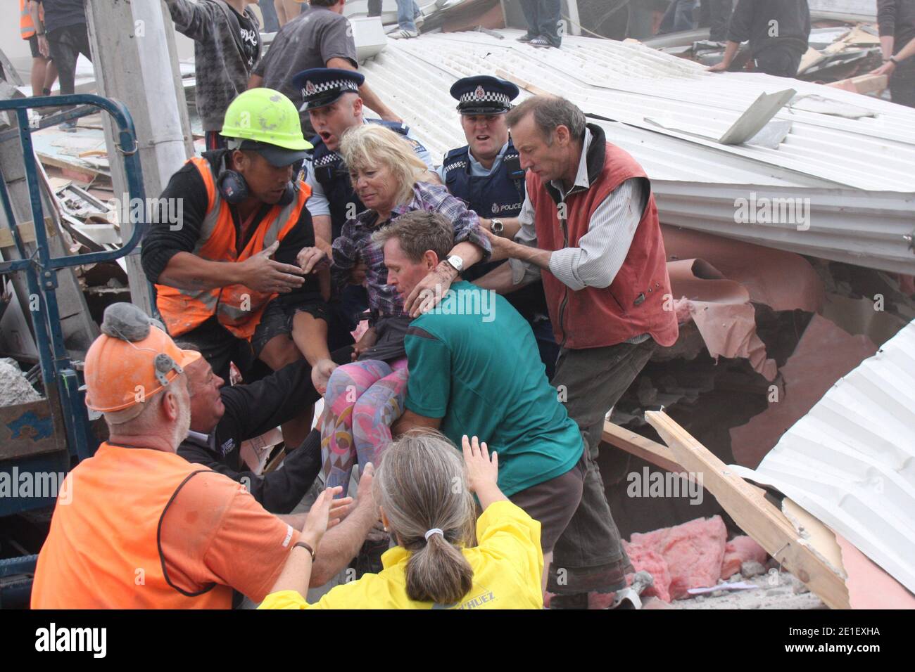 Emergency services and volunteers rescue people from the collapsed CTV ...