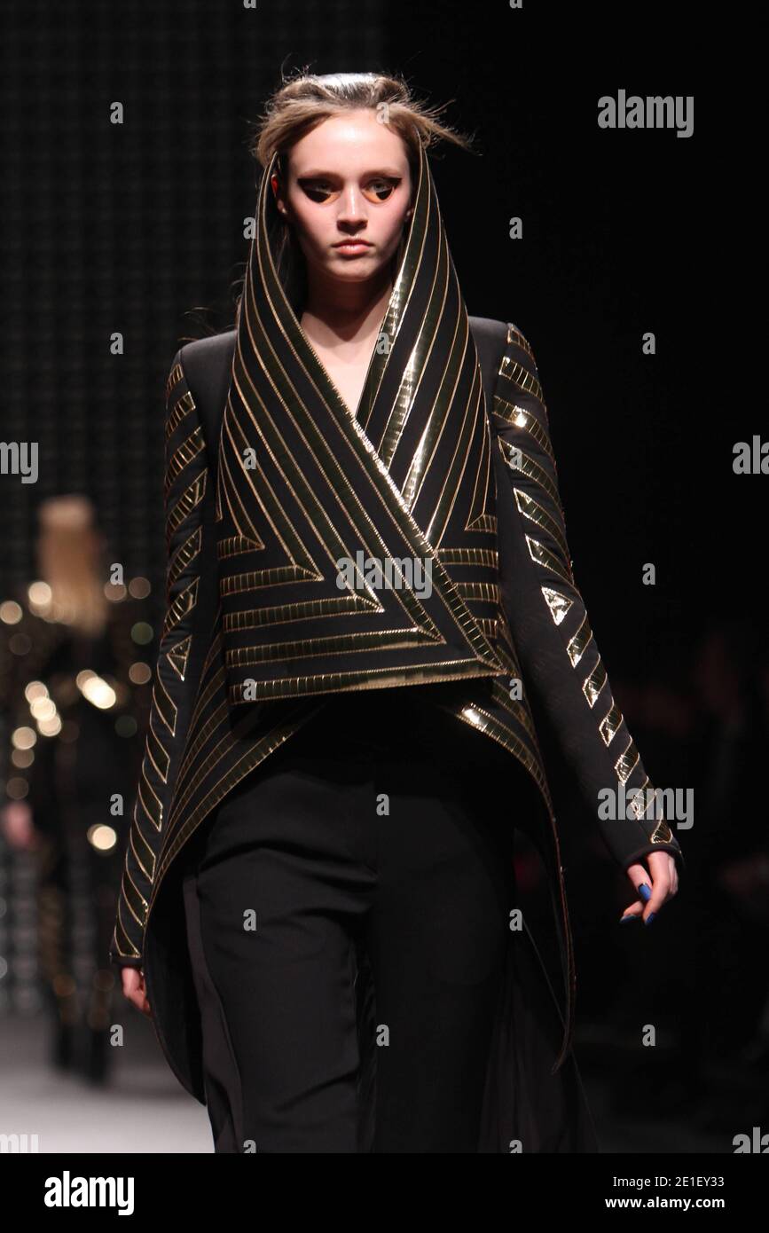 A model displays a creation designed by British Designer Gareth Pugh ...