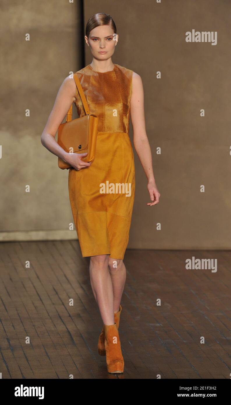 A model displays a creation designed by Alber Kriemler for Akris Fall ...