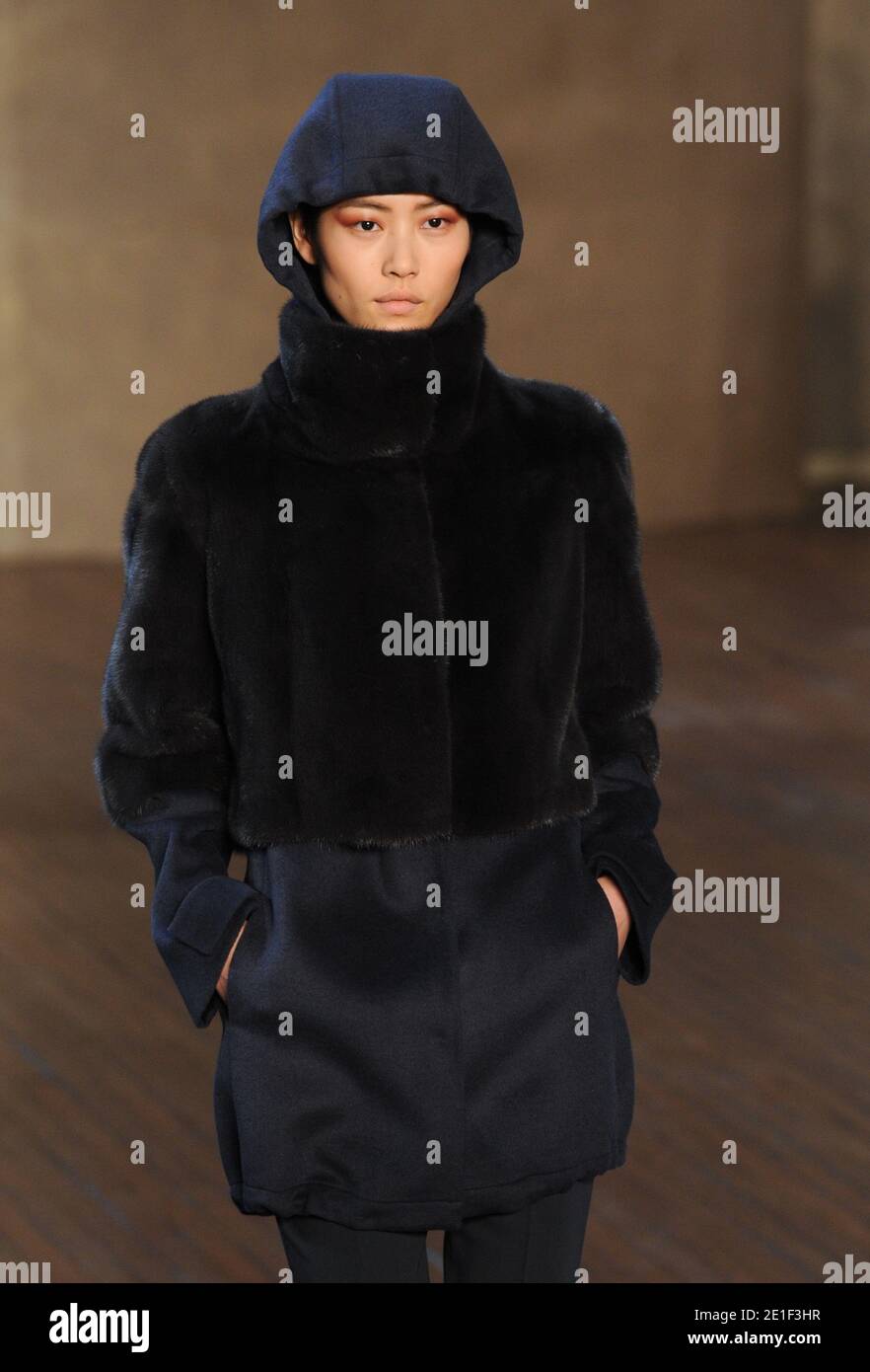 A model displays a creation designed by Alber Kriemler for Akris Fall ...