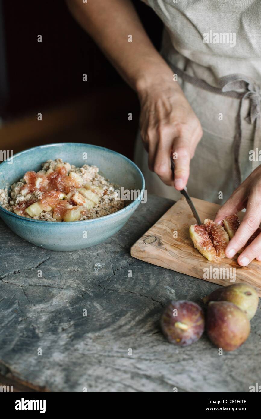 Woman cutting fresh figs hi-res stock photography and images - Alamy