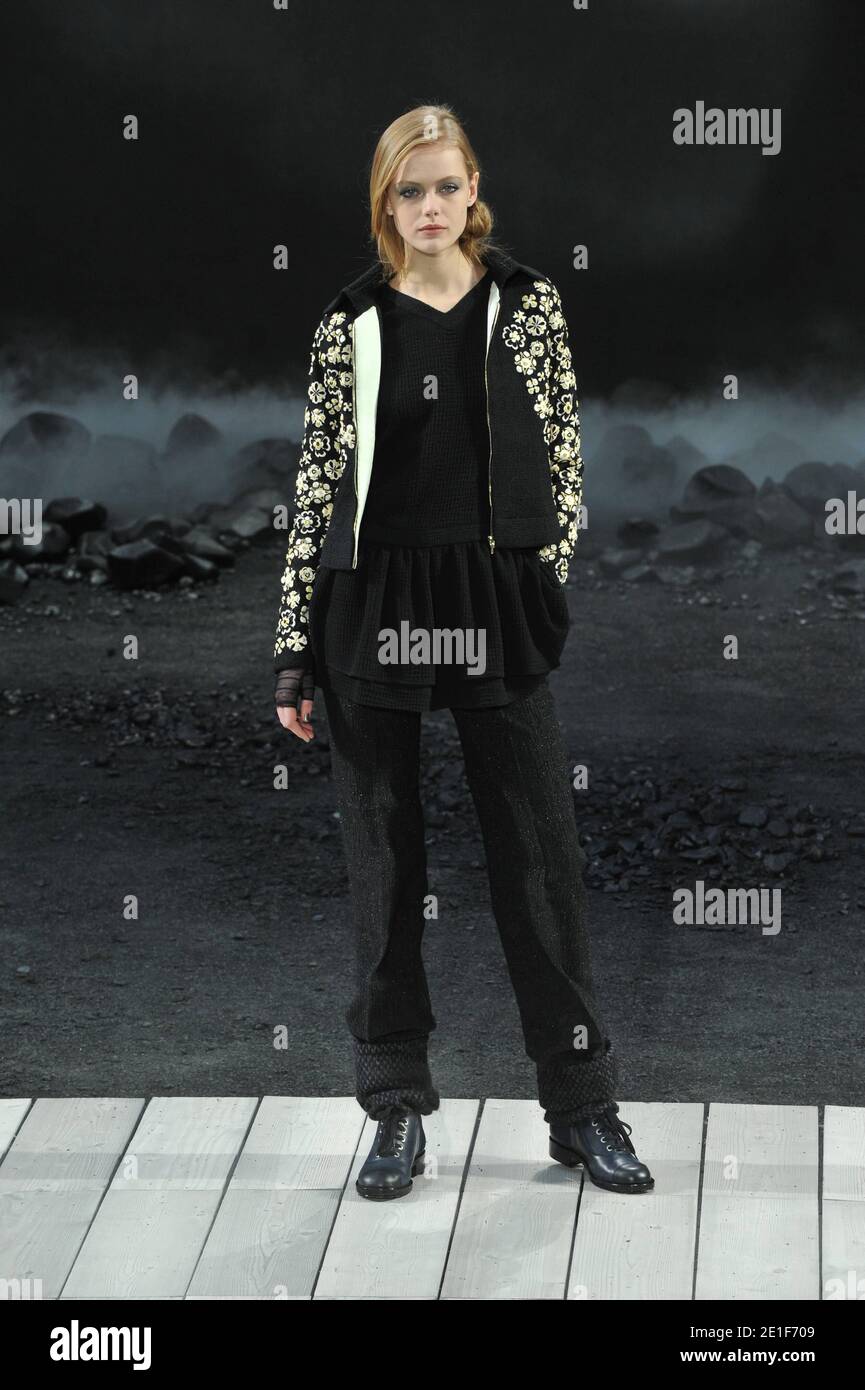 A model displays a creation designed by Karl Lagerfeld for Chanel Fall ...
