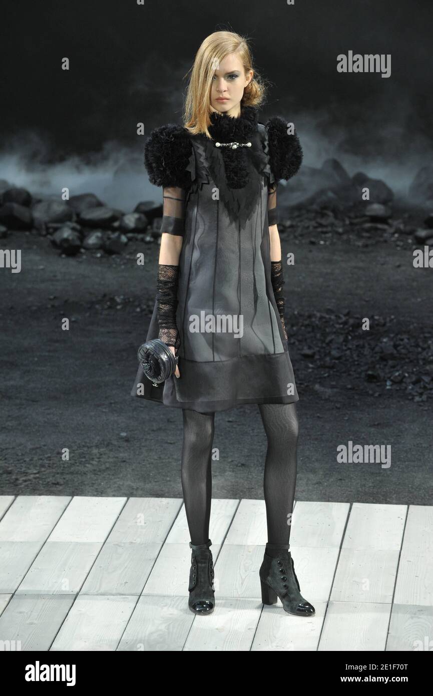 A model displays a creation designed by Karl Lagerfeld for Chanel Fall ...
