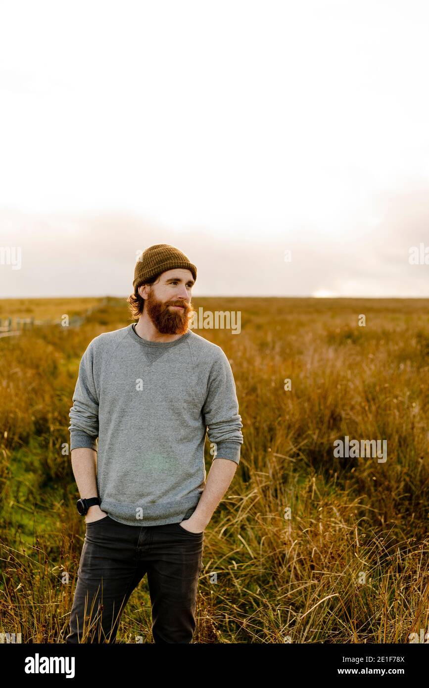 Bearded man in the english countryside at sunset Stock Photo - Alamy