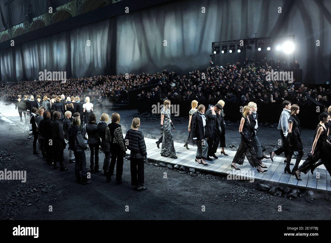 Models diplay creations designed by Karl Lagerfeld for Chanel Fall ...