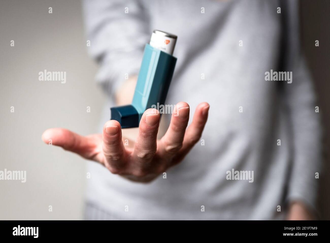 a patient holds his inhaler in his hand Stock Photo - Alamy