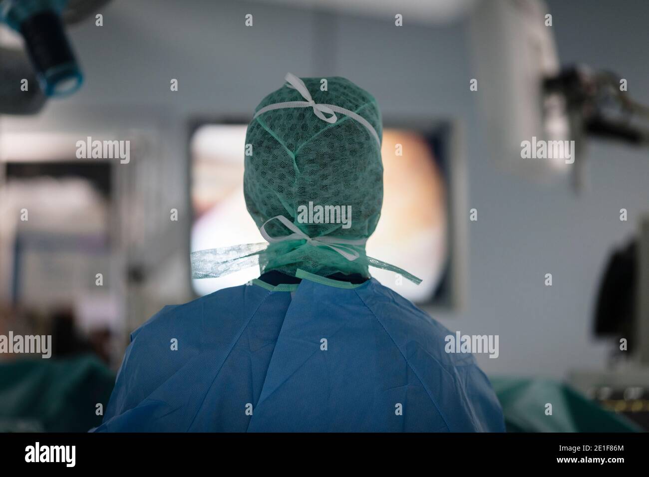 a surgeon looks at a monitor screen during surgery Stock Photo - Alamy