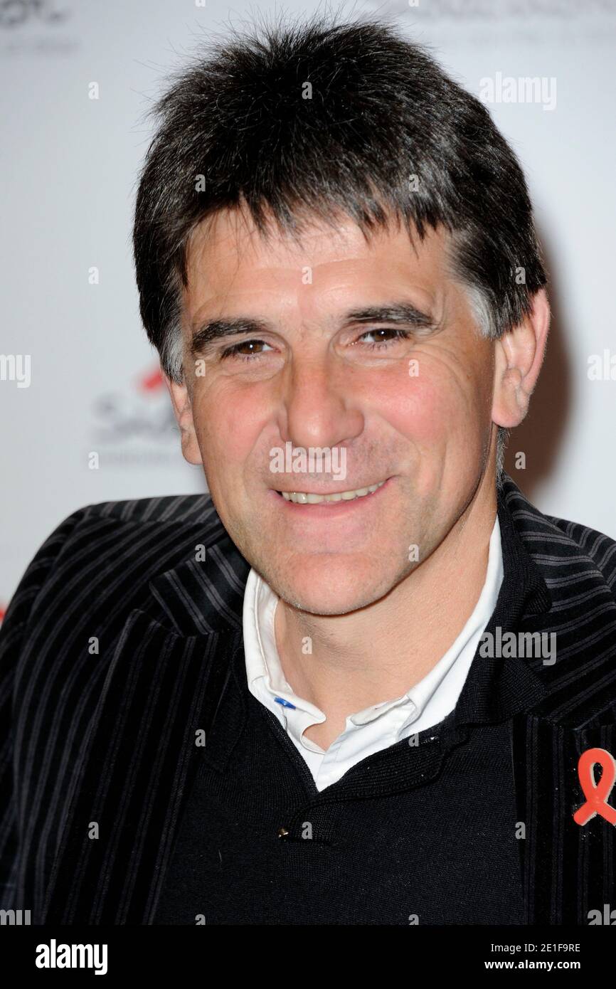 Tex posing at a photocall for the launch party of the 2011 Sidaction ...