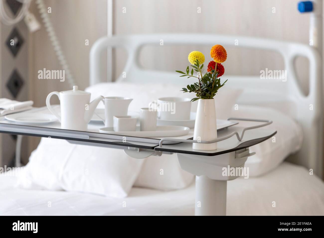a hospital bedside table, with a meal tray Stock Photo - Alamy