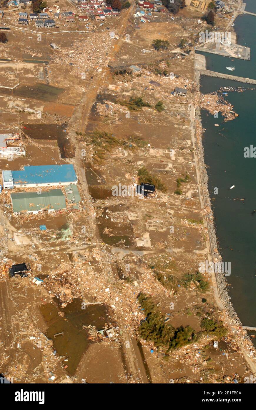 An aerial view of tsunami damage in an area north of Sendai, Japan ...