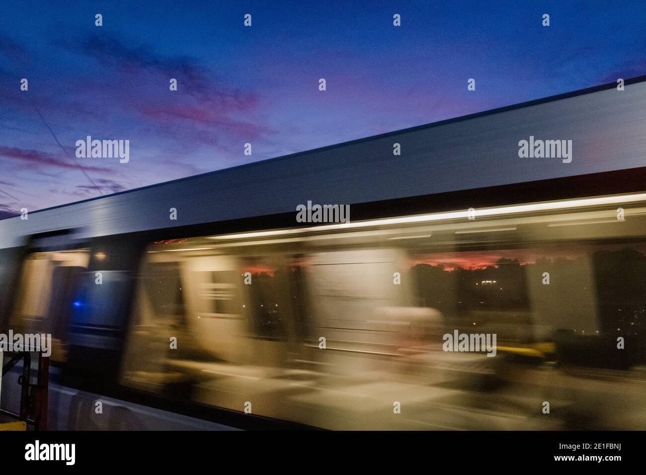 Metro train motion blur at night Stock Photo - Alamy