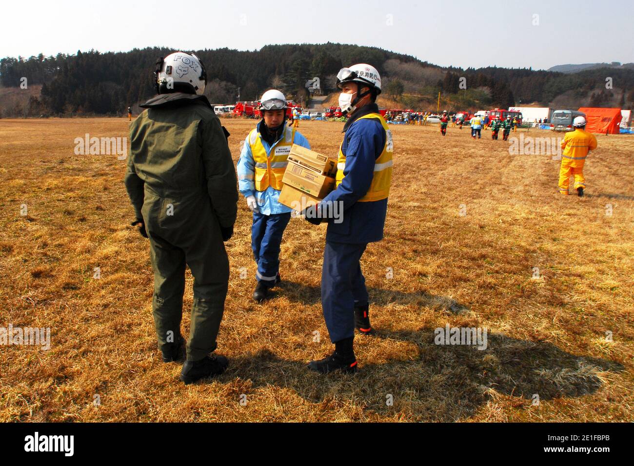 Japanese aid worker accept humanitarian relief supplies from U.S. Navy ...