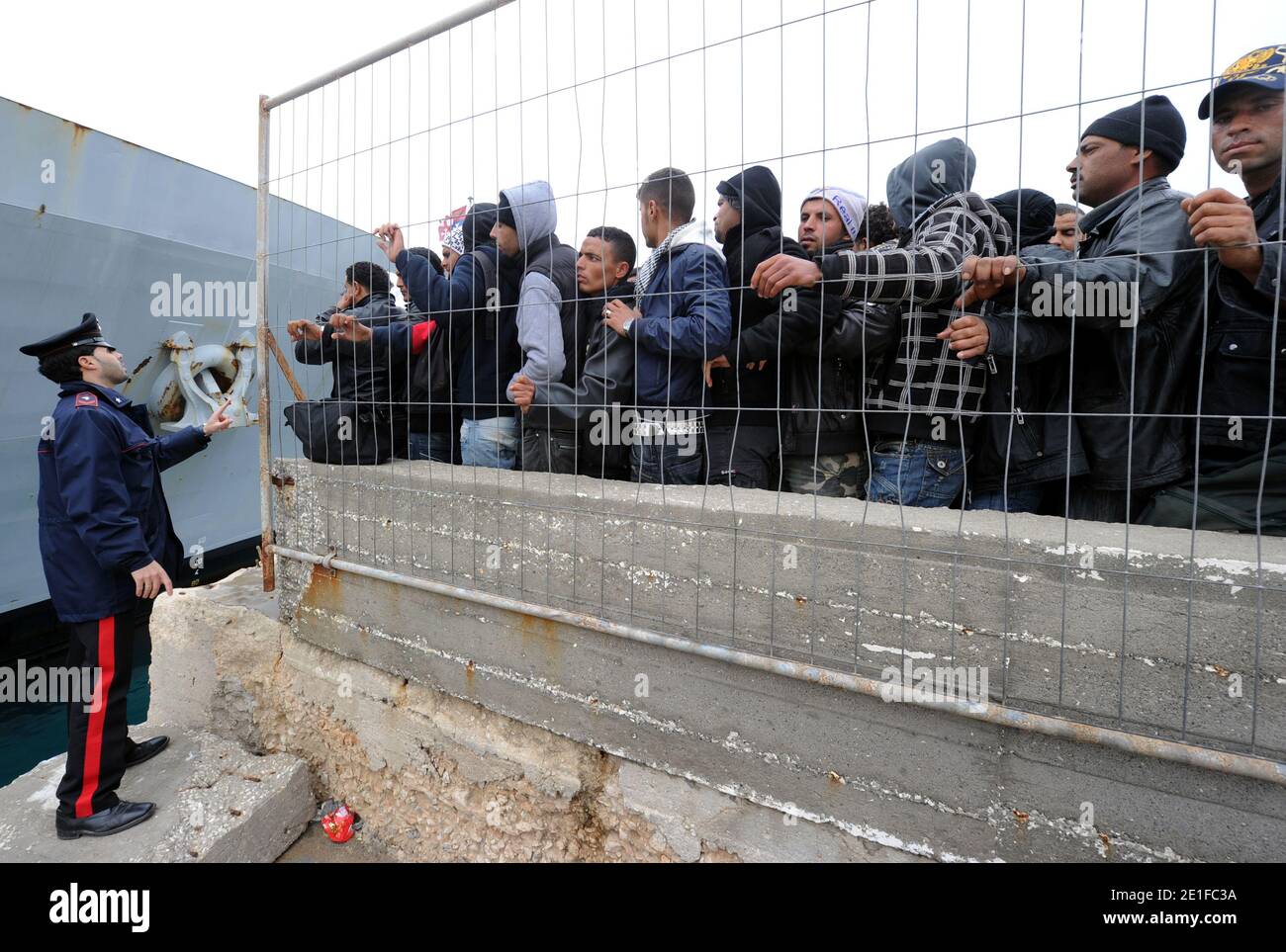 Tunisian immigrants land on the Italian island of Lampedusa on march 15 ...