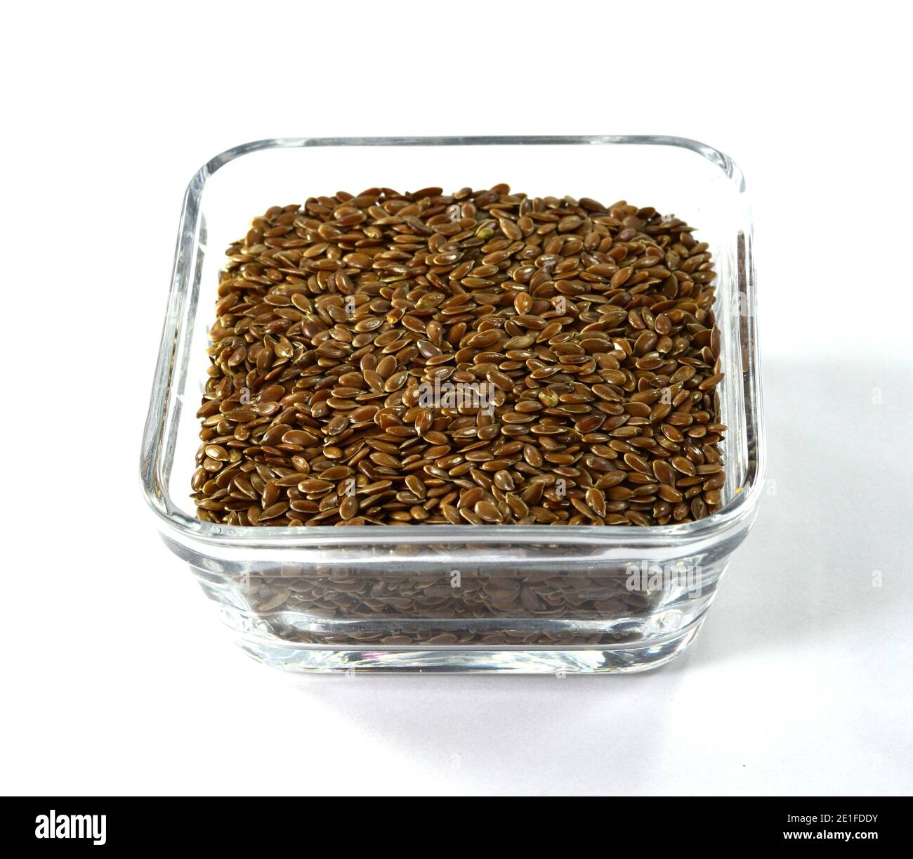 Organic Linseed or Flaxseed (Linum usitatissimum) in a bowl isolated on white background Stock ...