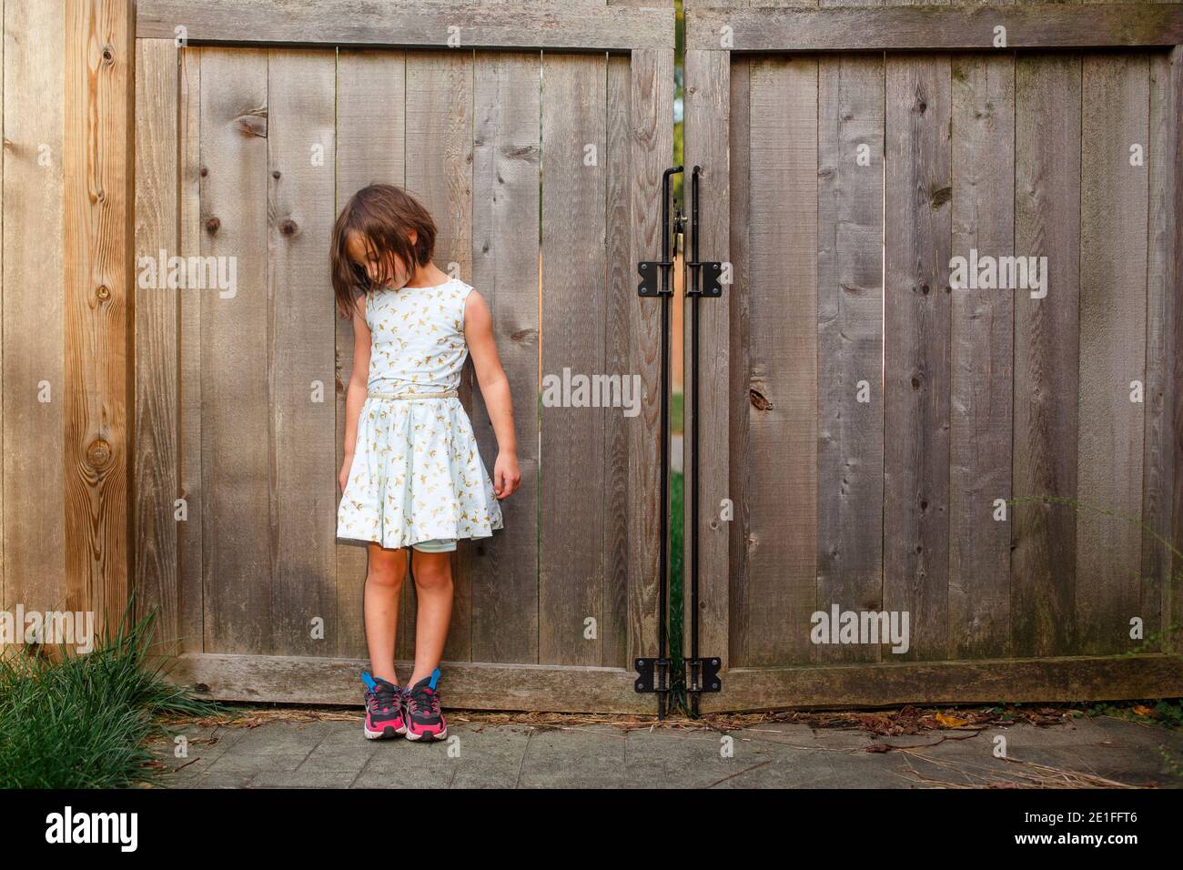 Girl by wooden gate hi-res stock photography and images - Alamy