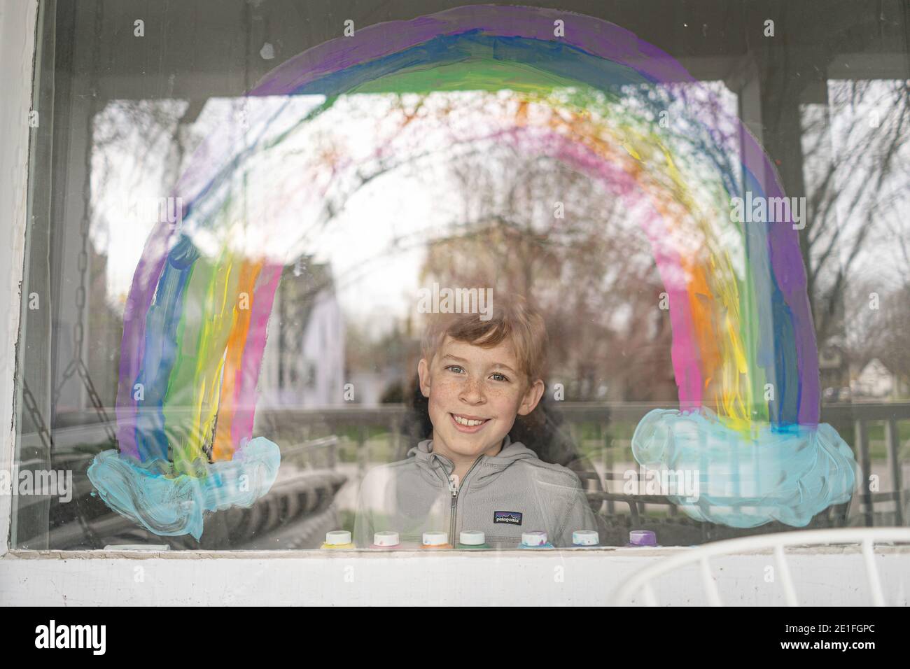 Kids playing under rainbow hi-res stock photography and images - Alamy