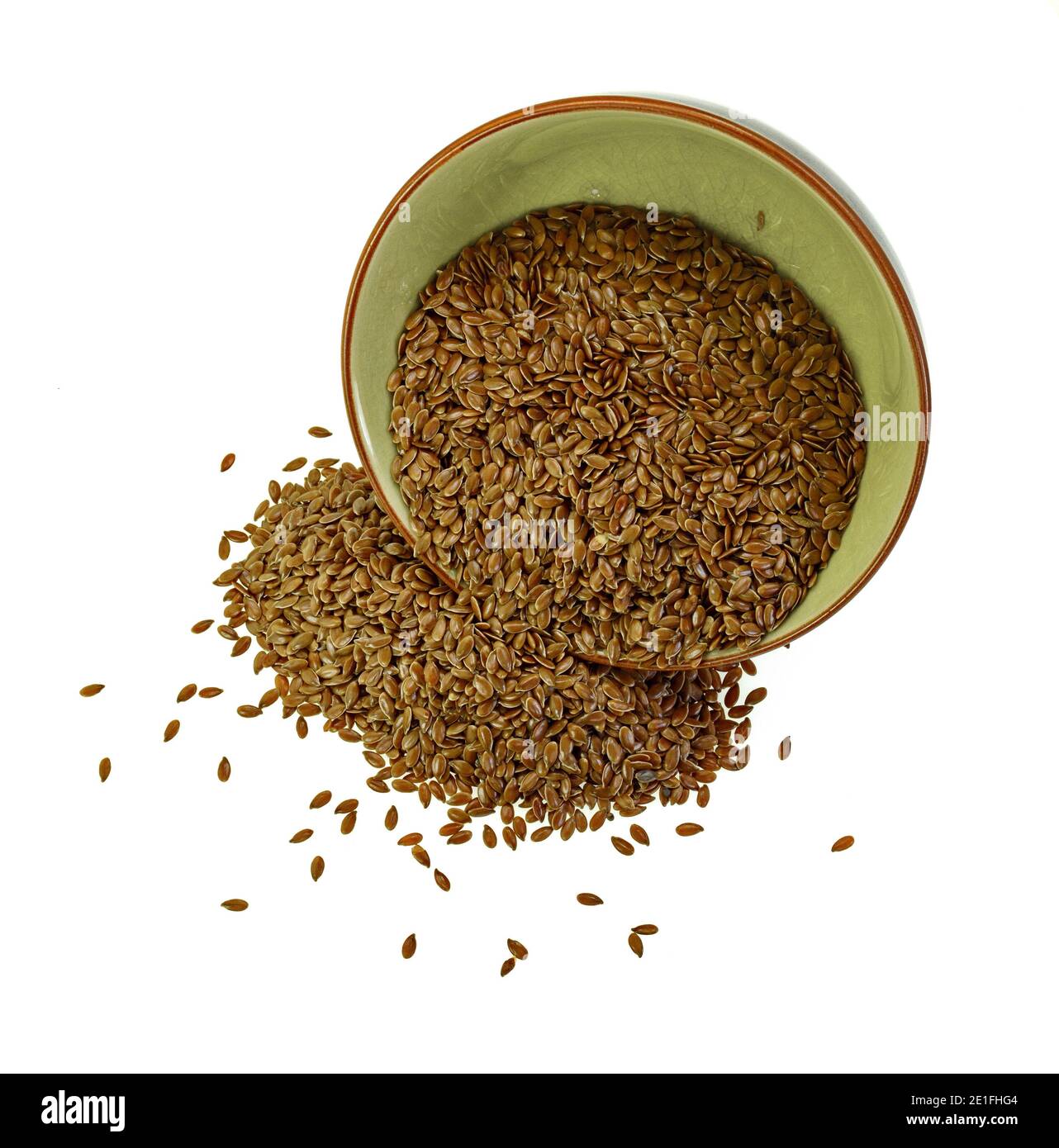 Organic Linseed or Flaxseed (Linum usitatissimum) in a bowl isolated on white background Stock ...