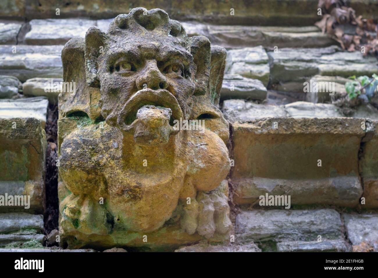 Stone gargoyle for spitting rain water from the roof of the building ...