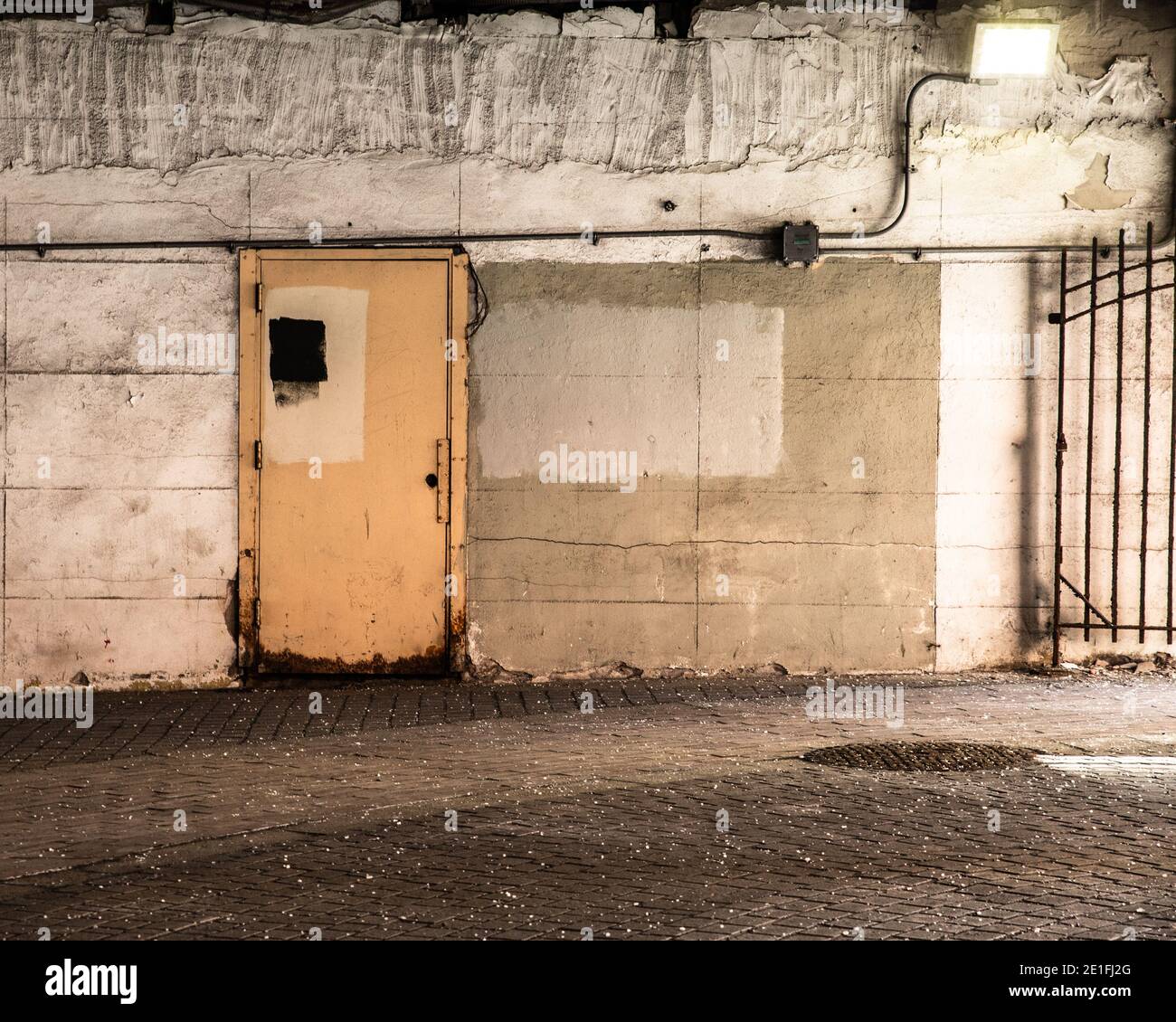 Interior of industrial grungy garage with gates Stock Photo - Alamy