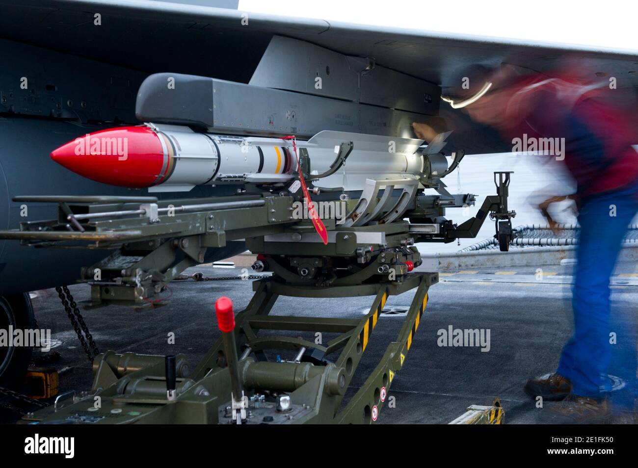 French mecanician mounting a Mica missile on a Rafale jet fighter in ...