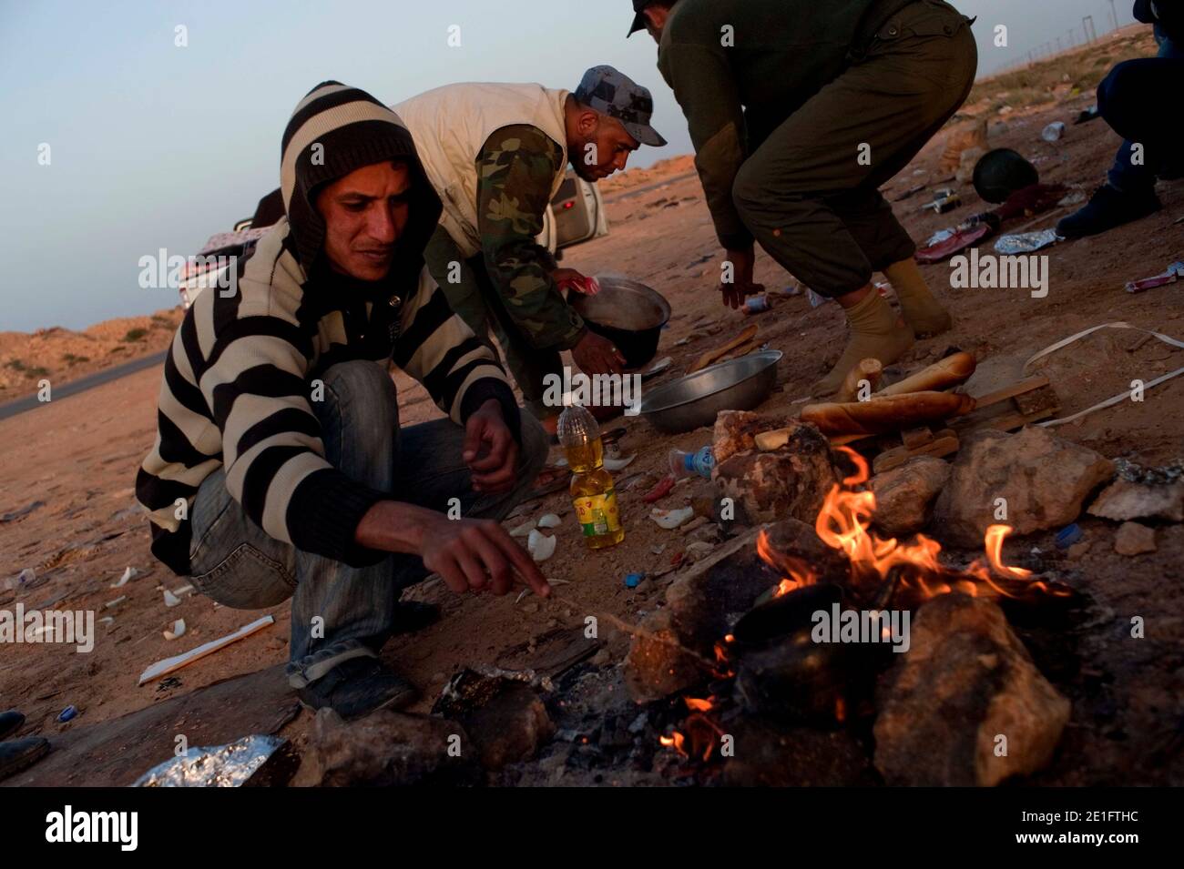 Libyan rebels retread from the frontline between Bin Jawad and ras ...