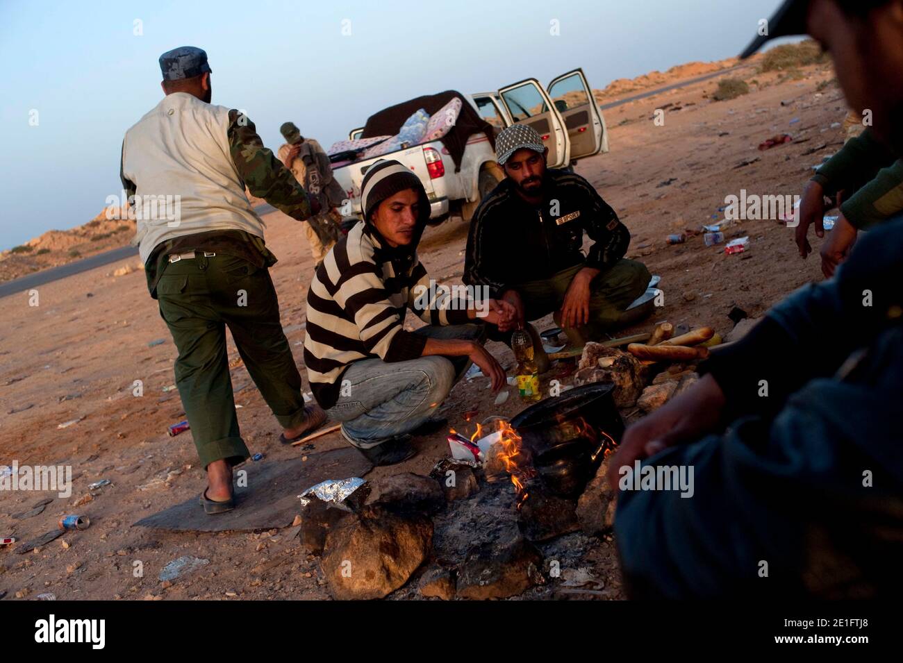 Libyan rebels retread from the frontline between Bin Jawad and ras ...