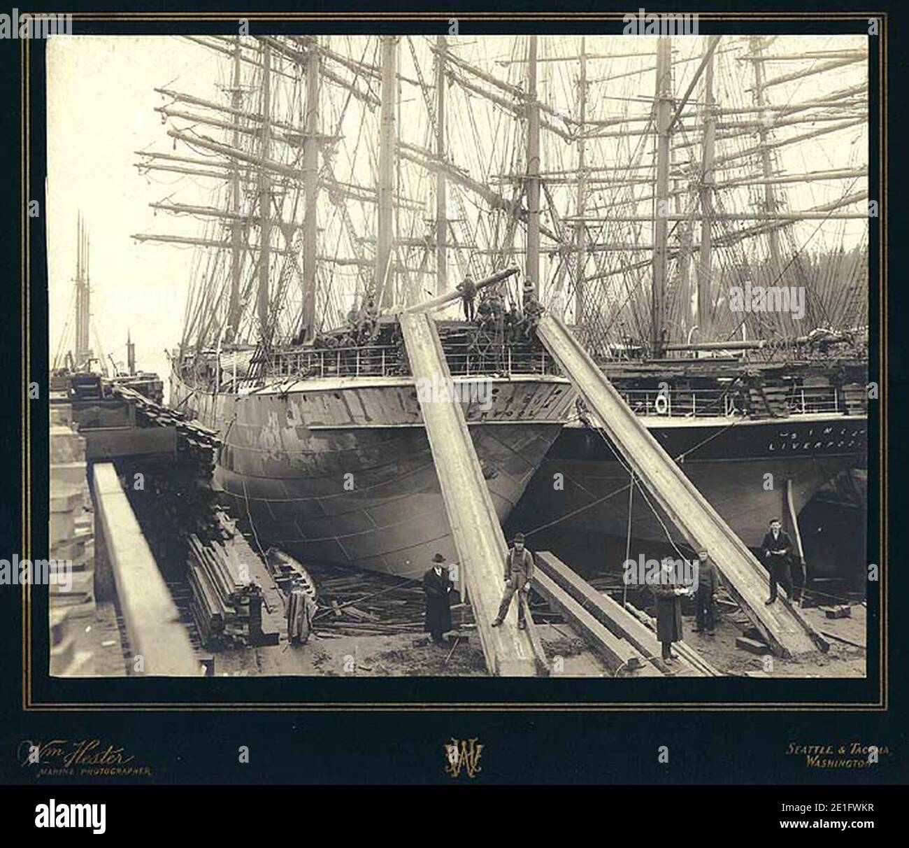 Loading lumber onto the four masted bark AUSTRASIA using lumber chutes ...