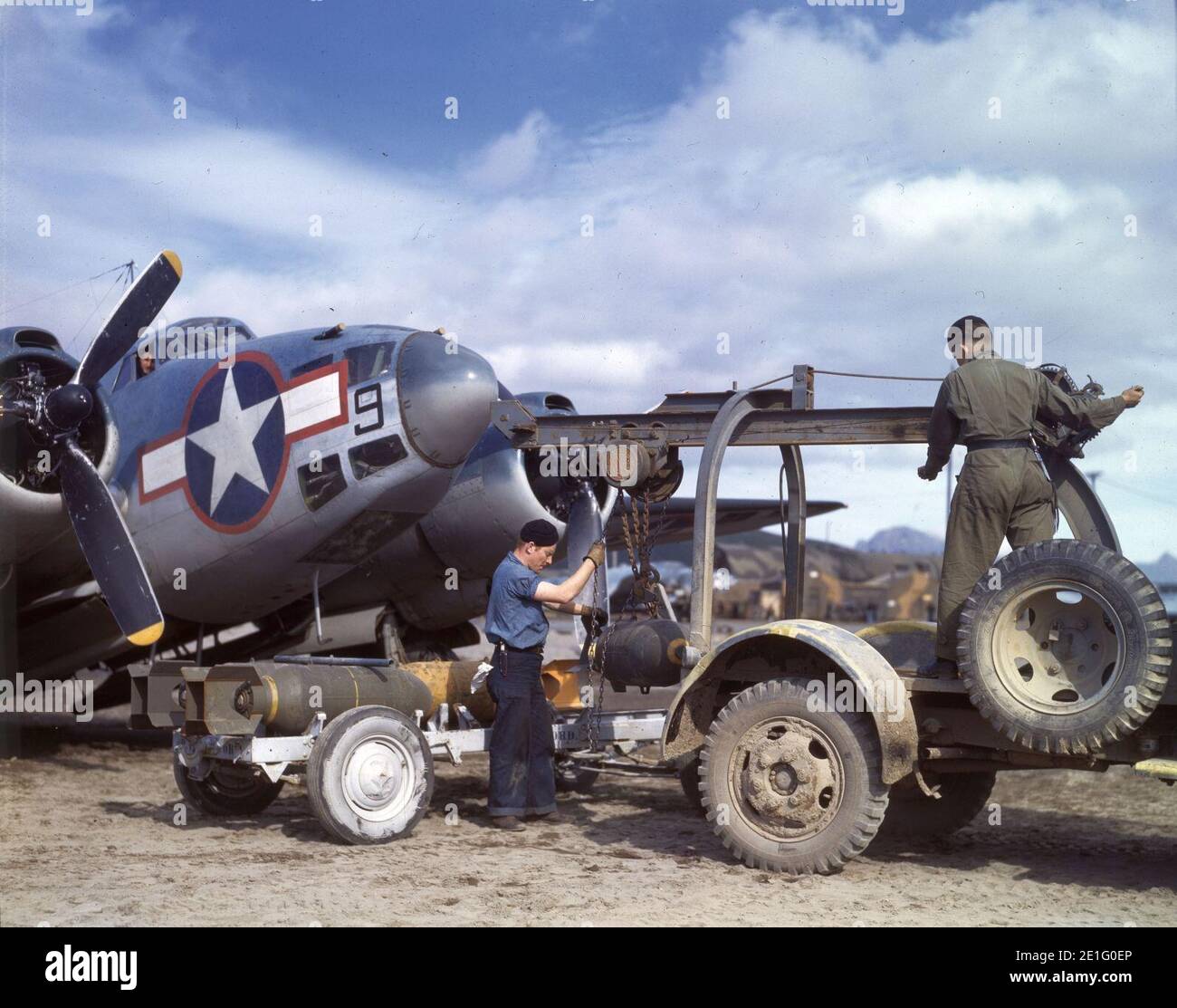 Lockheed PV-1 Ventura is loaded with bombs at an Aleutians airbase ...