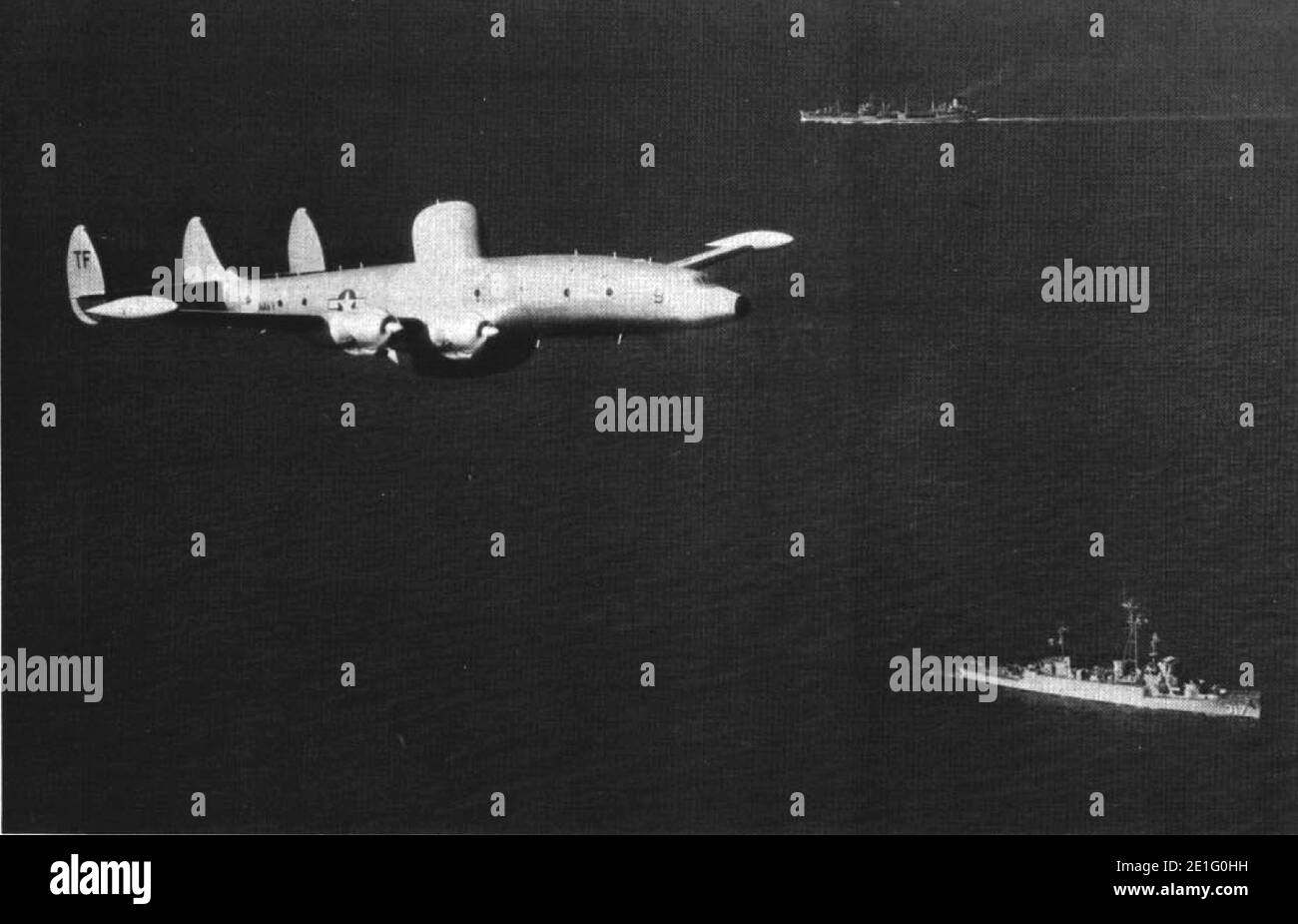 Lockheed WV-2 flies over USS Joyce (DER-317) in the 1950s Stock Photo ...