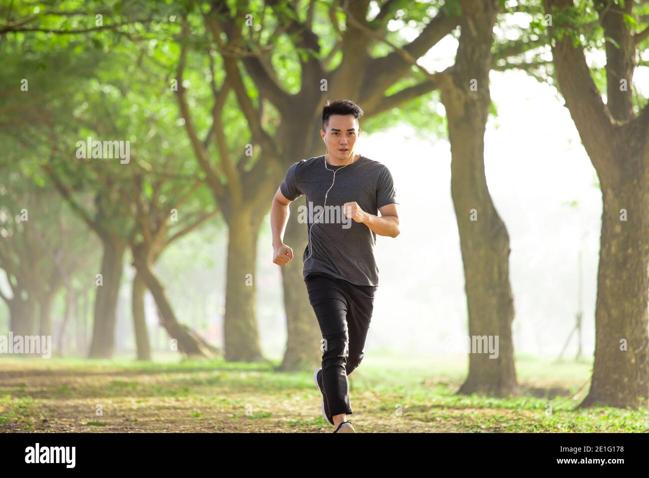Young asian man running on hi-res stock photography and images - Alamy