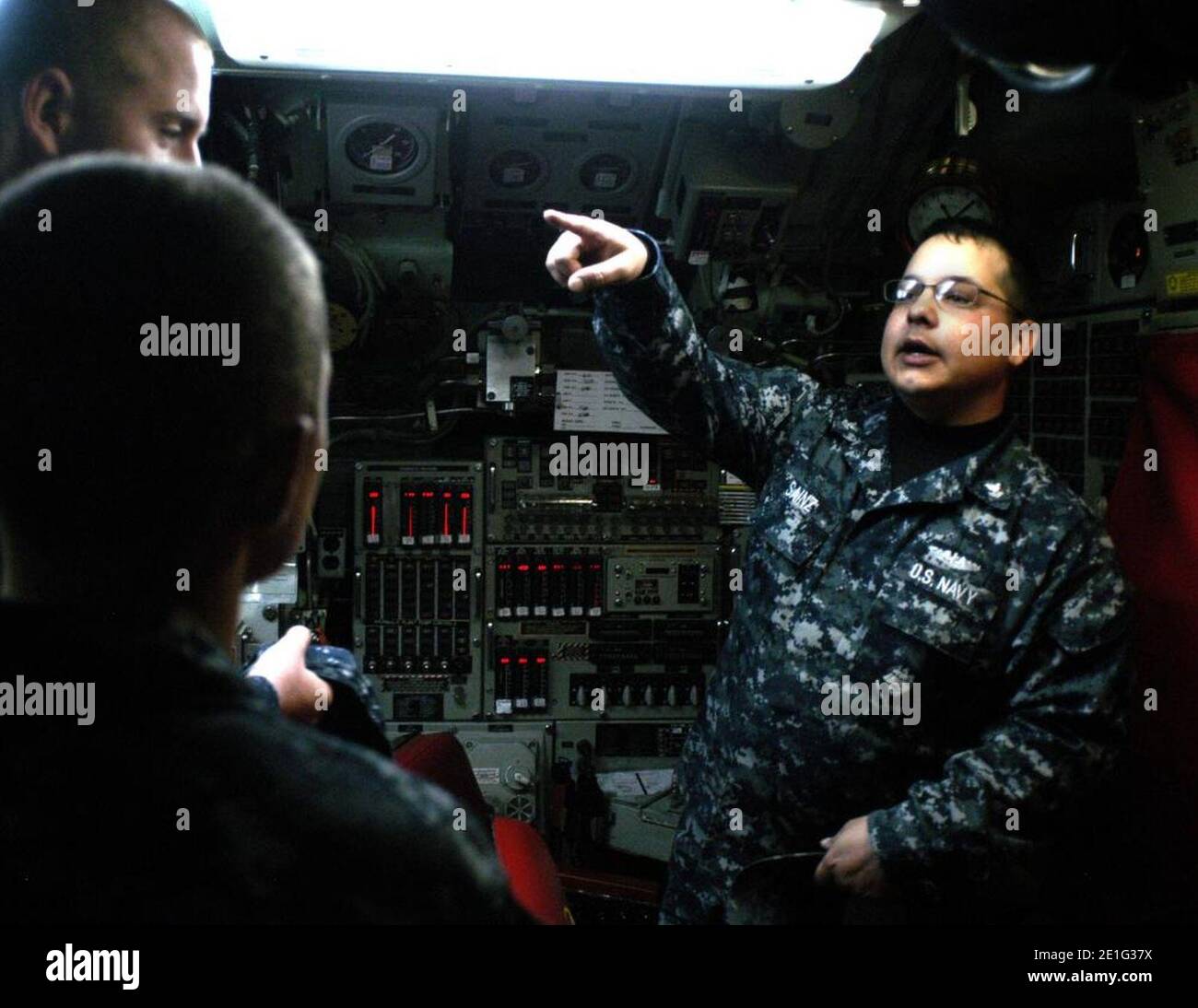 Logistics Specialist 2nd Class explains the ship's control center to ...
