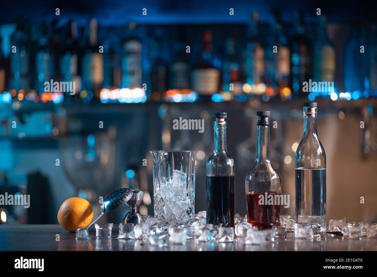 set of ingredient for negroni cocktail with ice, orange, rum, vodka and ...