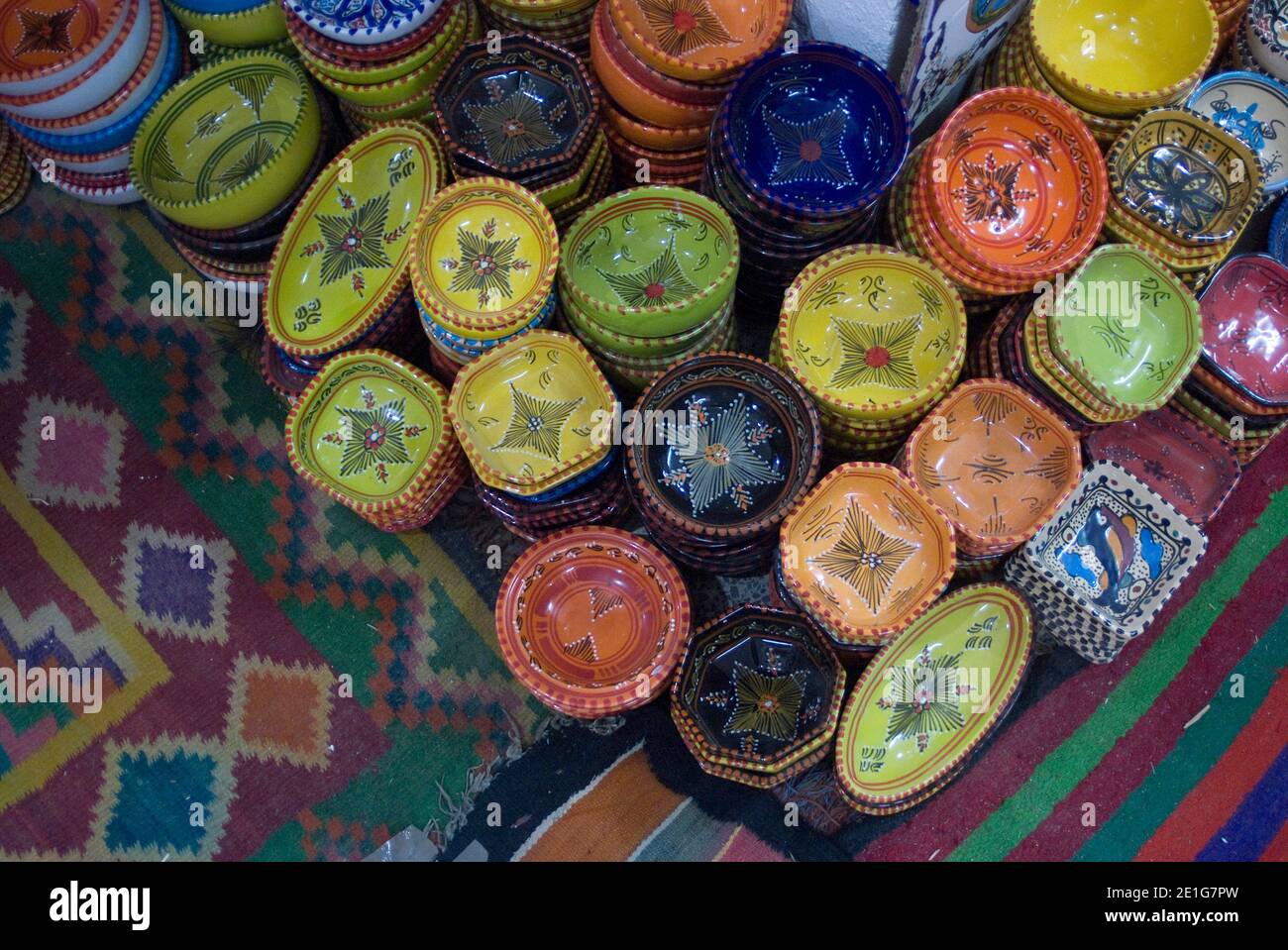 Colourful plates, bowls, tourist souvenirs and kitsch from the pottery ...