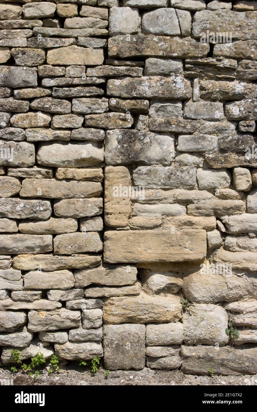 Ancient brick and stone wall detail, Burford, Oxfordshire, Cotswolds ...