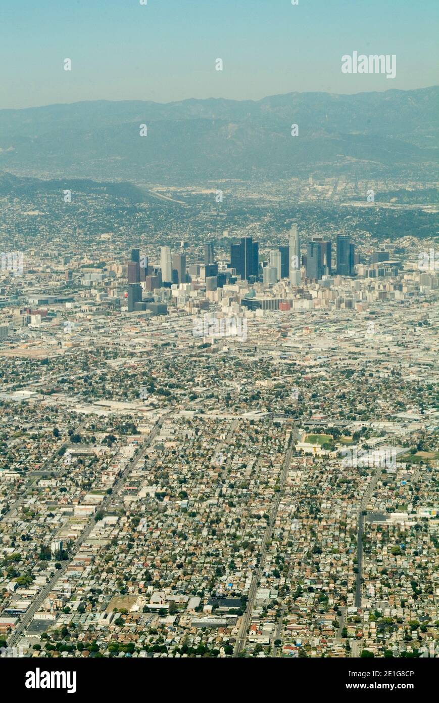 Aerial view of Los Angeles, with a street grid foreground and Downtown ...