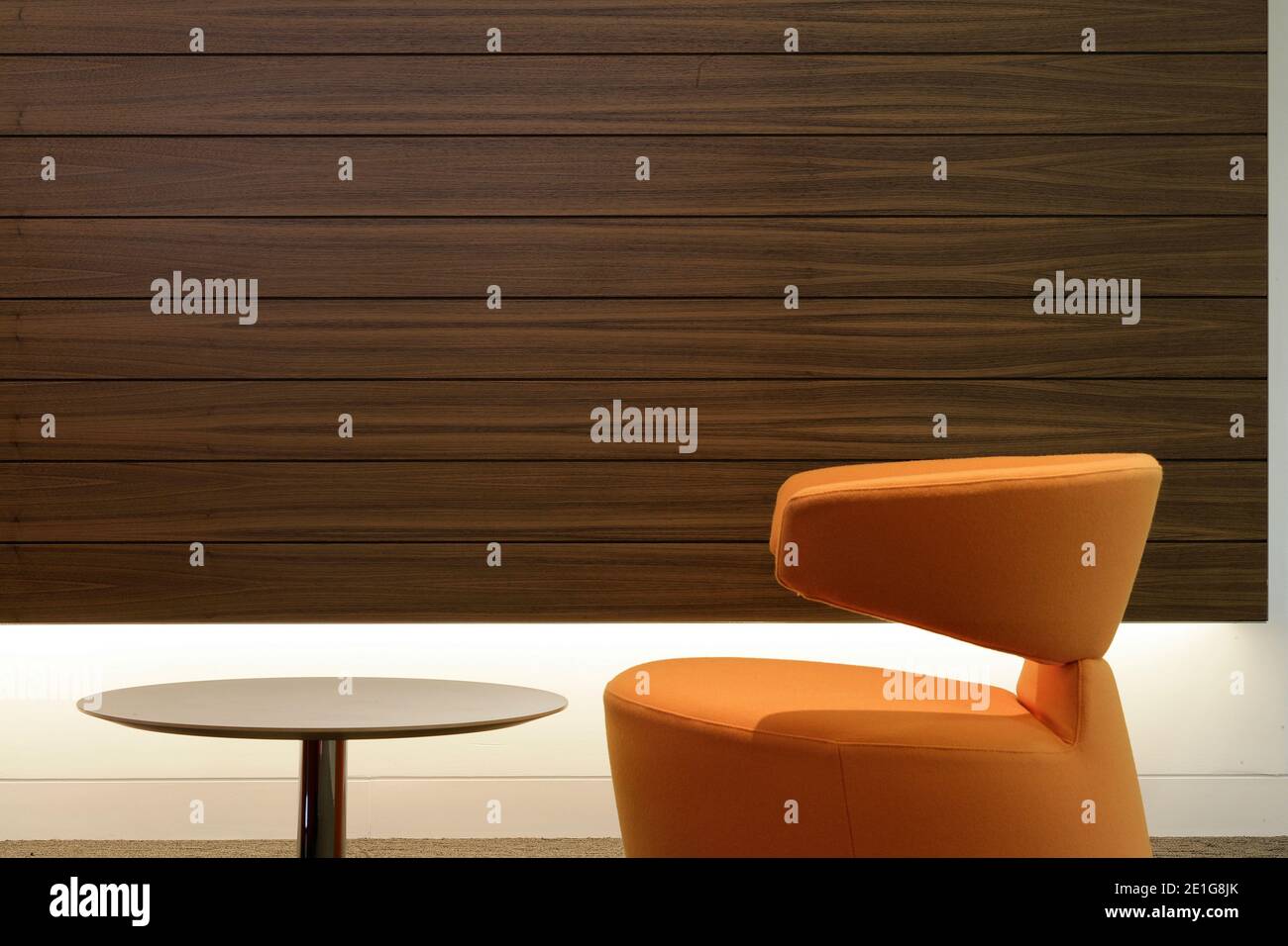Orange leather chair and table in interior Office Space, UK Stock Photo ...